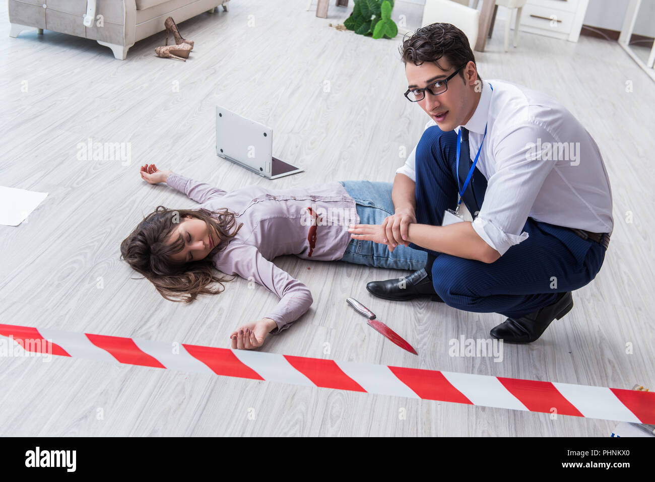 Forensic investigator at the crime scene investigating woman mur Stock ...