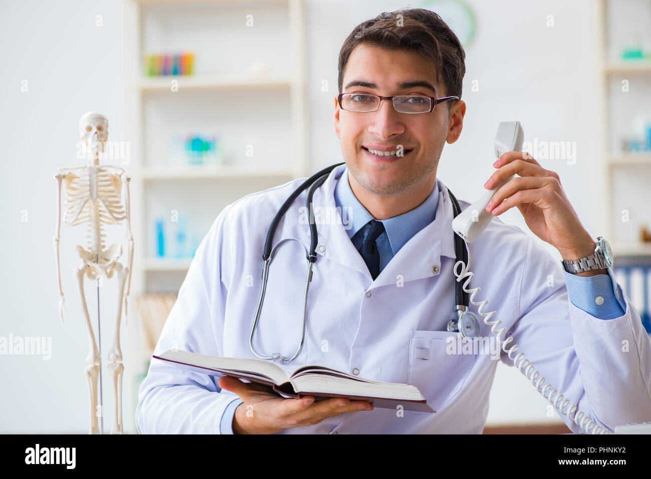 Doctor student studying the bones of skeleton Stock Photo - Alamy