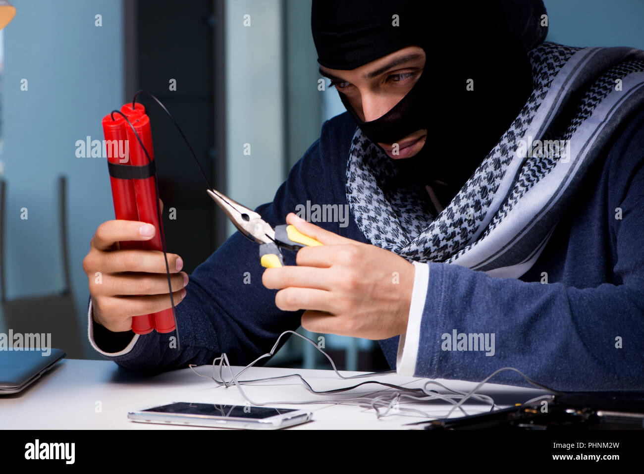 Terrorist bomber preparing dynamite bomb Stock Photo - Alamy