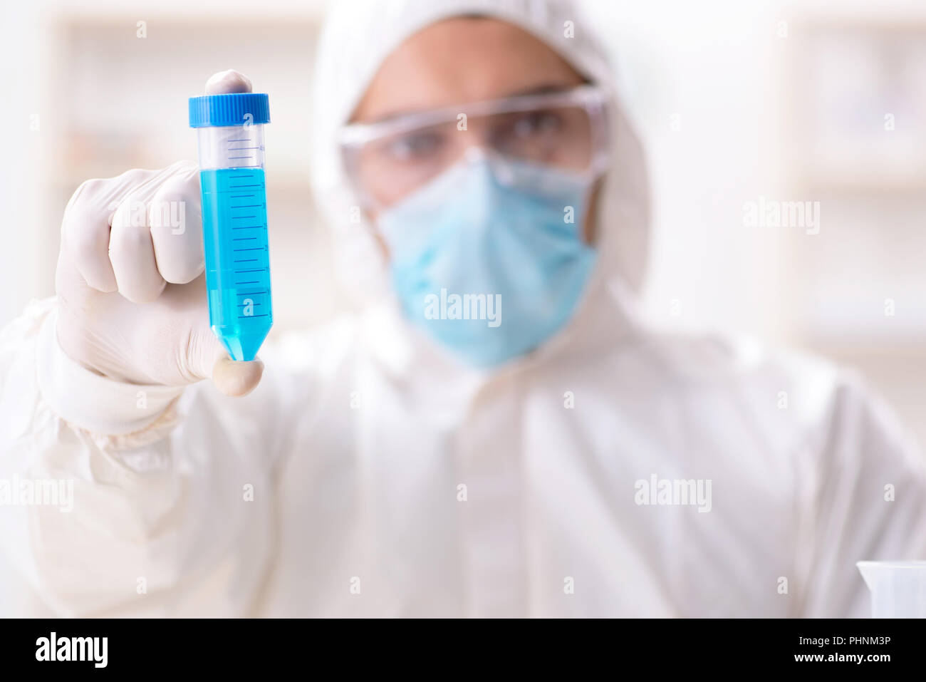 Young chemist student working in lab on chemicals Stock Photo - Alamy