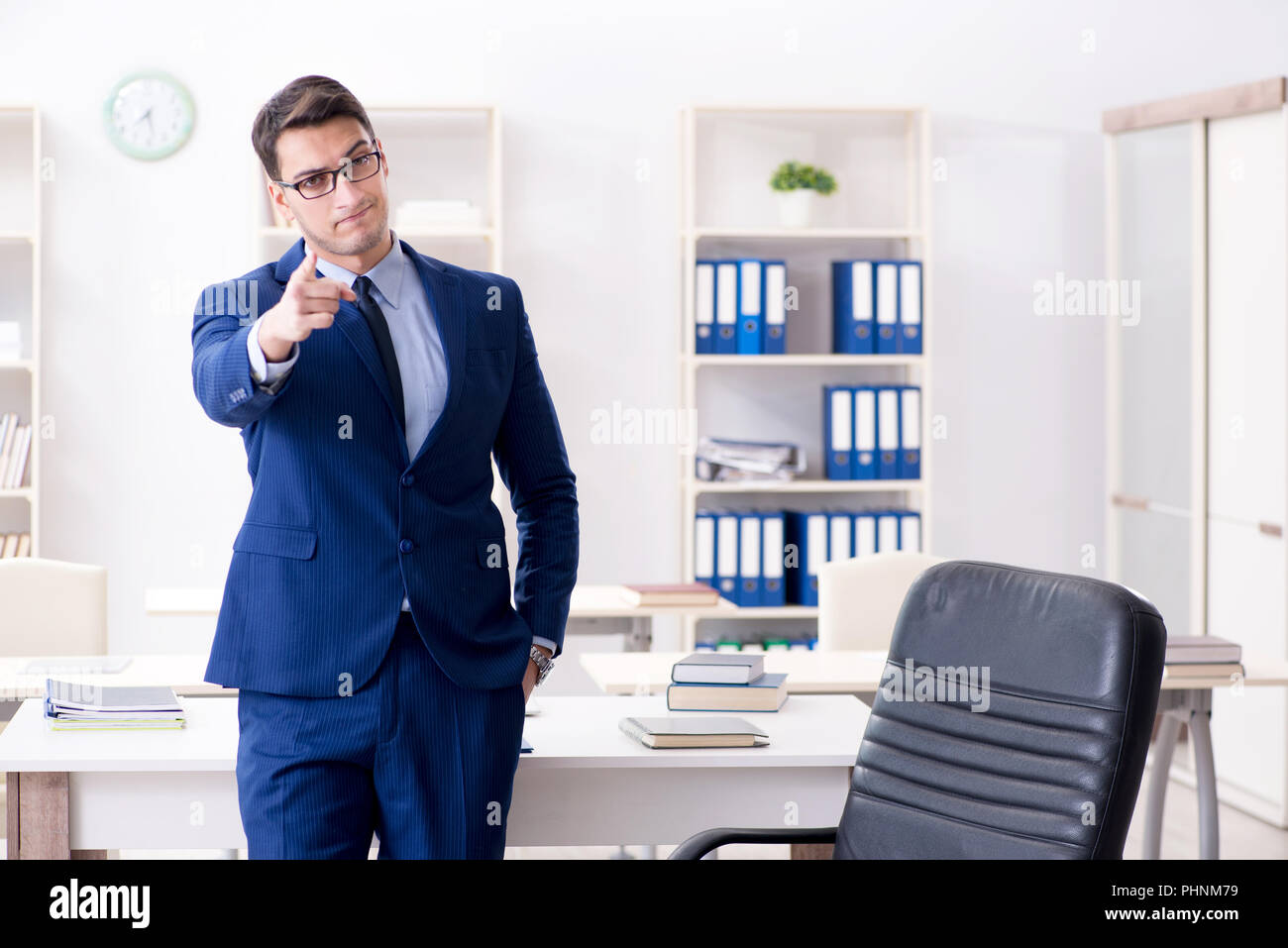 Young handsome businessman employee working in office at desk Stock ...