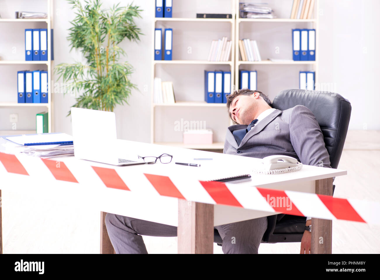 Dead businessman at this desk Stock Photo - Alamy