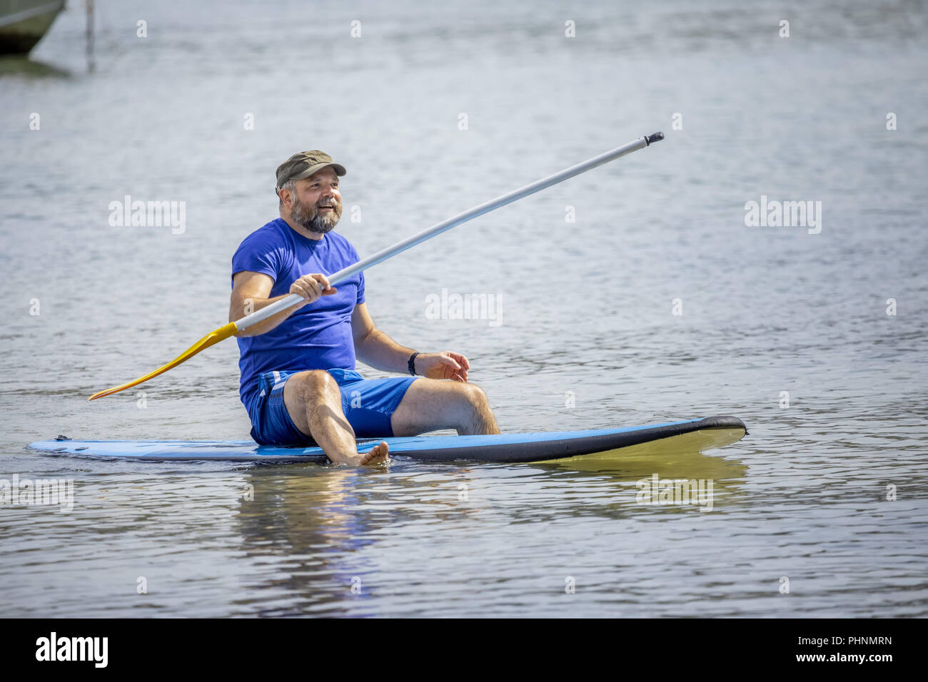 Man paddling in sea hi-res stock photography and images - Alamy