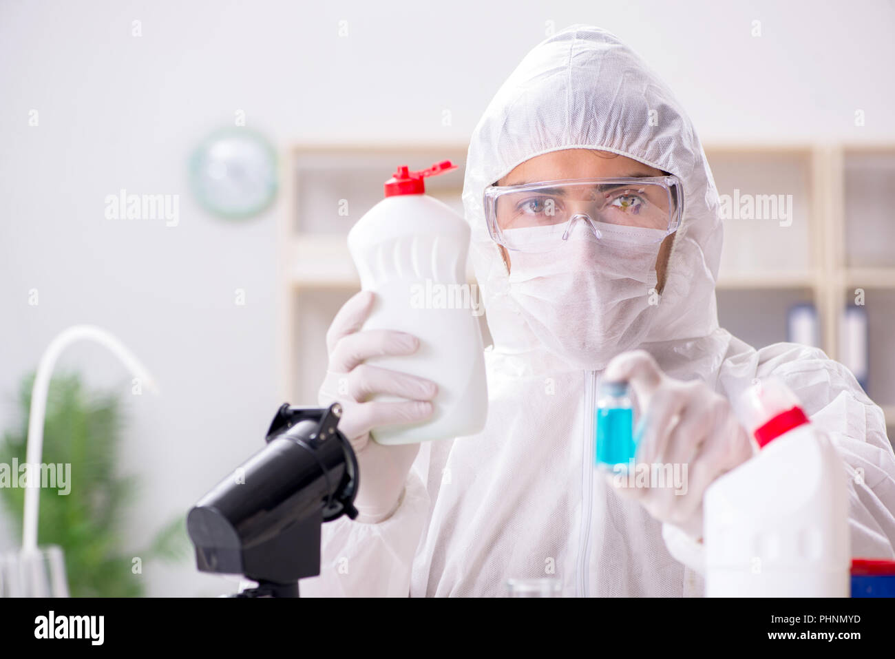 Chemist checking the quality of bathroom supplies Stock Photo - Alamy