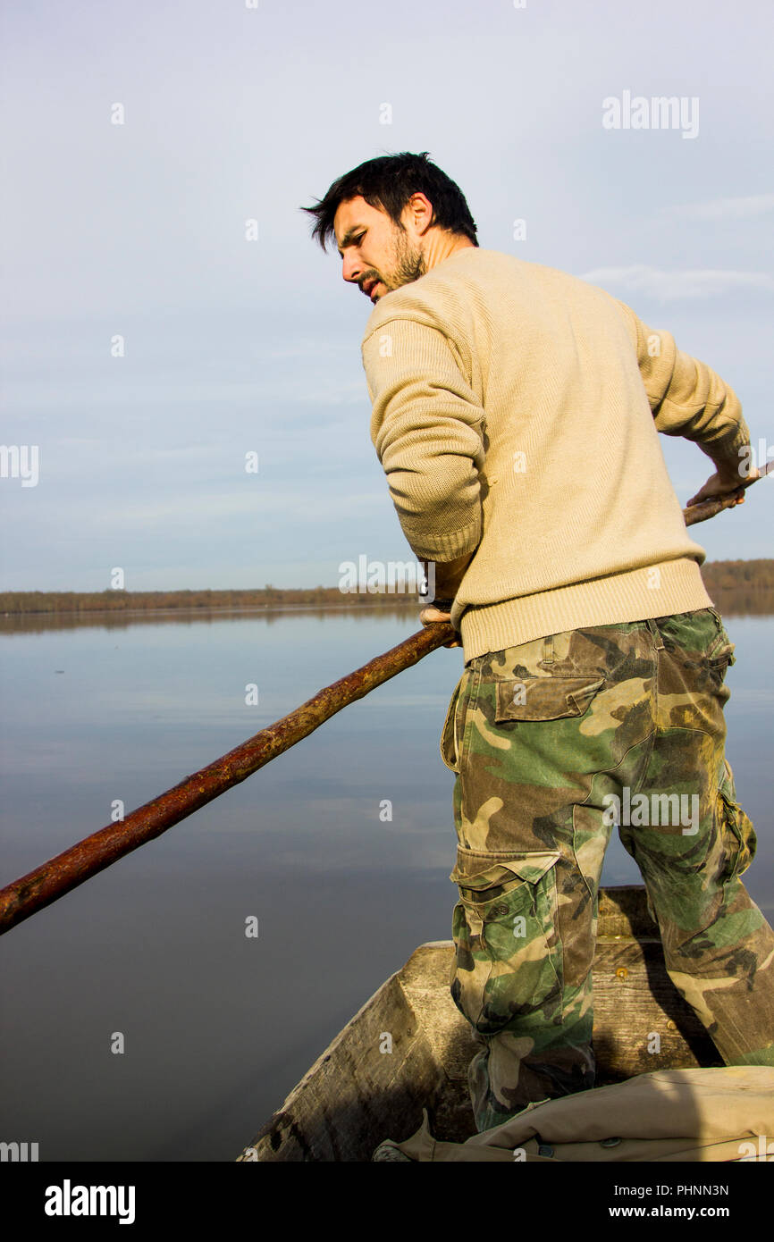 Man in boat on the river, rowing, adventure, real Stock Photo - Alamy