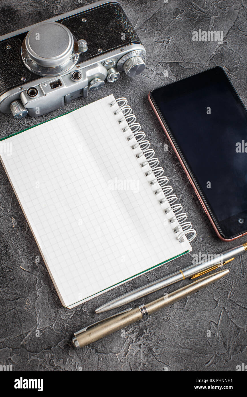 Notebook with film camera Stock Photo - Alamy