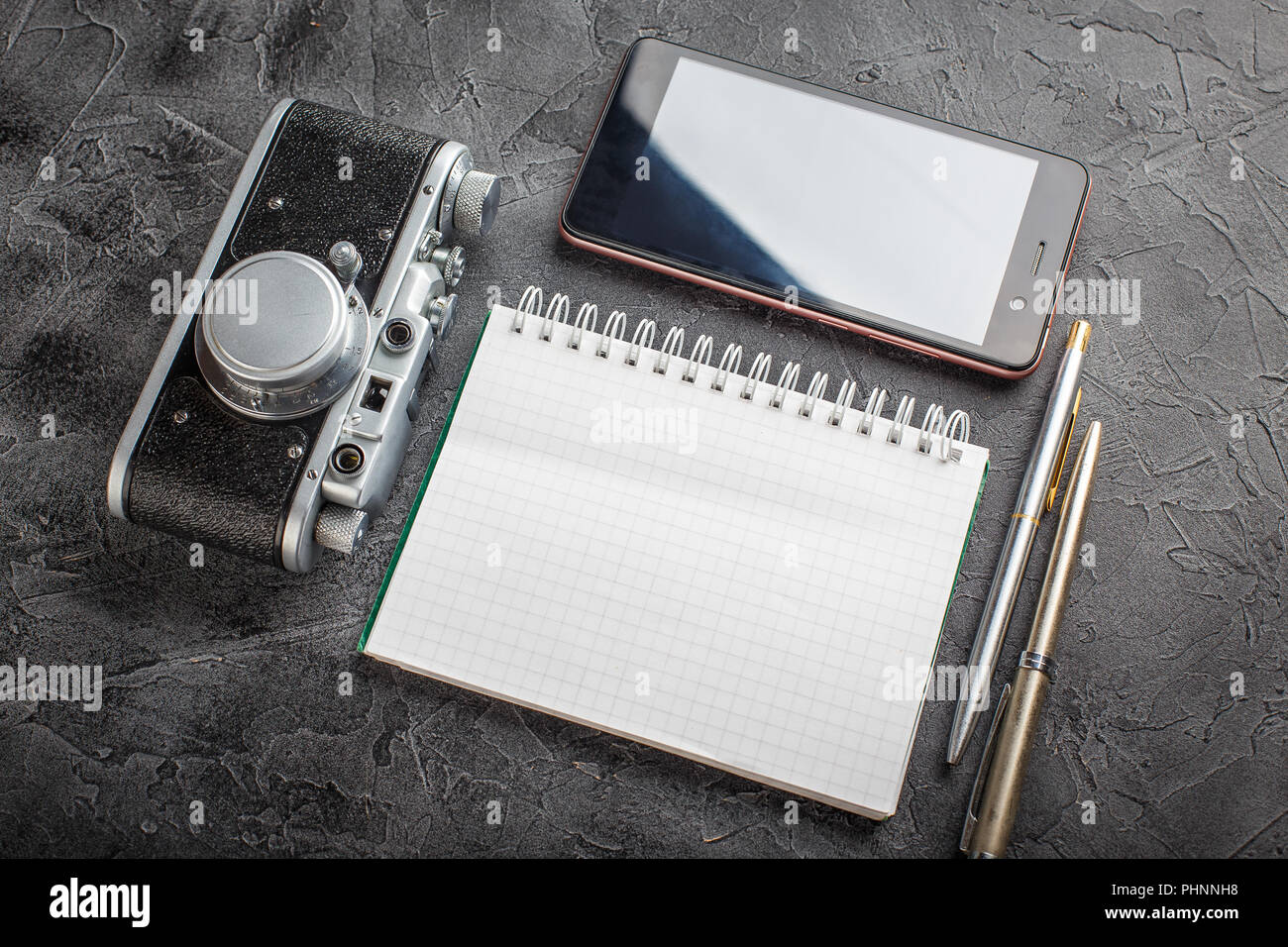 Notebook with film camera Stock Photo - Alamy