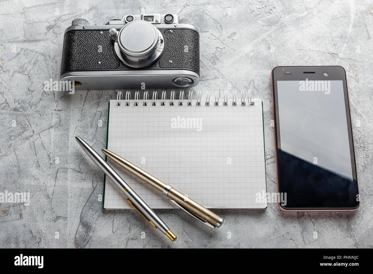 Notebook with film camera Stock Photo - Alamy