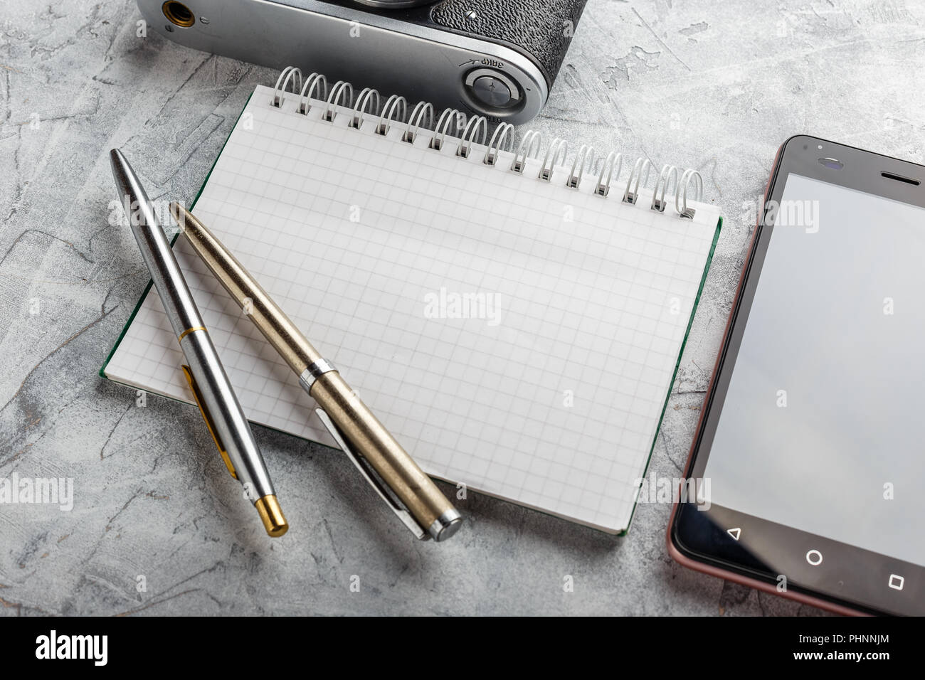 Notebook with film camera Stock Photo - Alamy