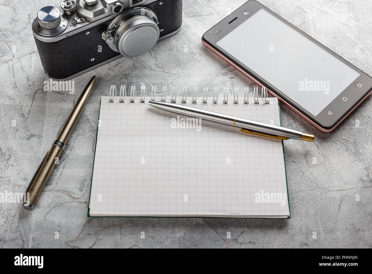 Notebook with film camera Stock Photo - Alamy