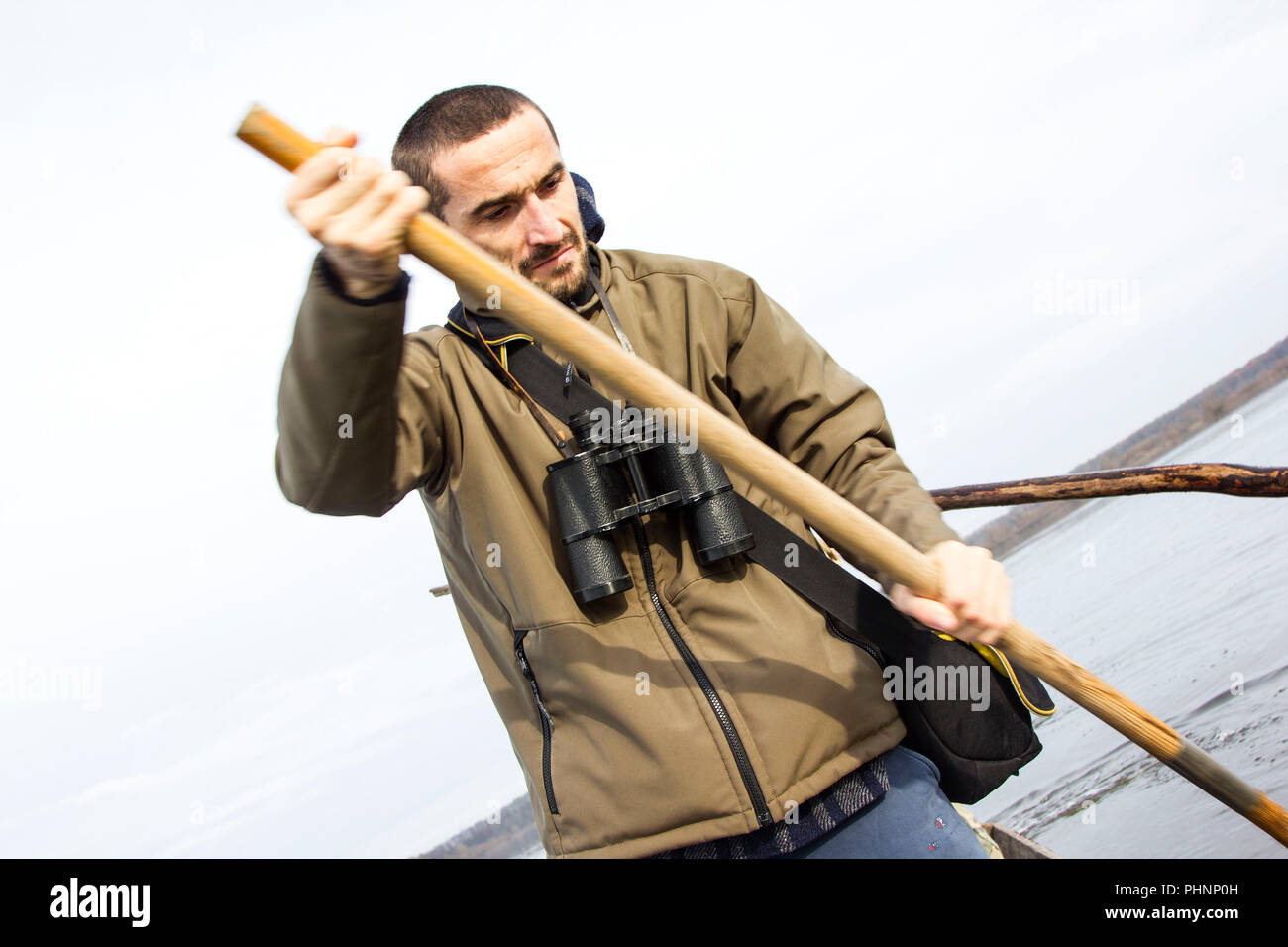 Man in boat on the river, rowing, adventure, real Stock Photo - Alamy