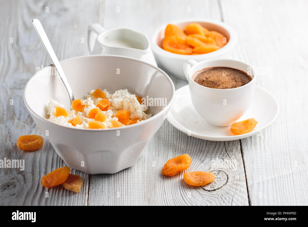 Cottage cheese and apricots Stock Photo - Alamy