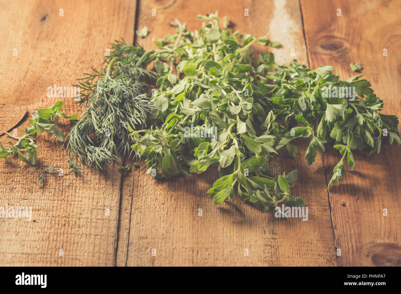 Spicy herb marjoram on a wooden table Stock Photo - Alamy
