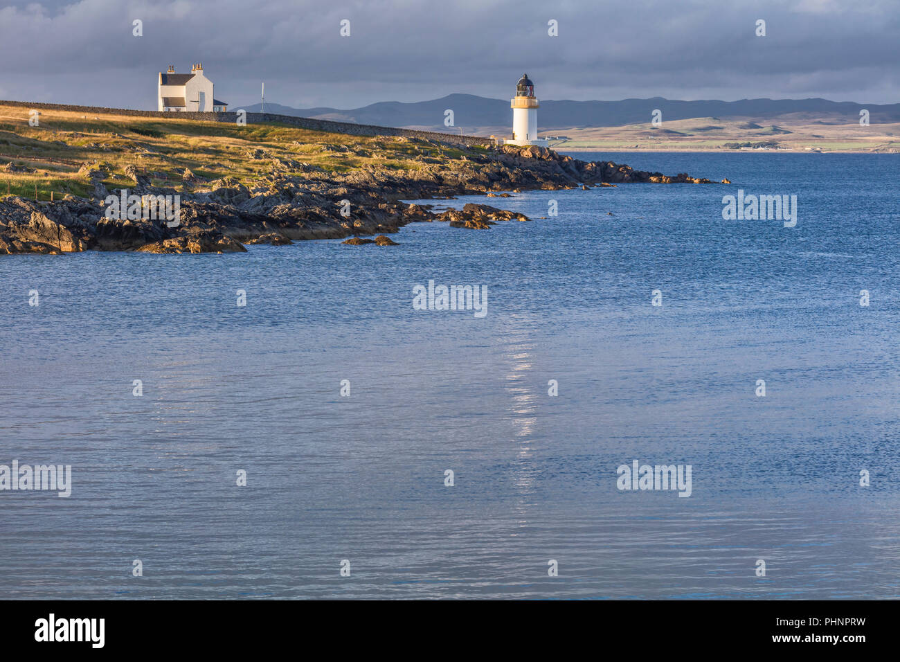 Sea coast with lighthouse, Port Charlotte, Islay, Inner Hebrides ...
