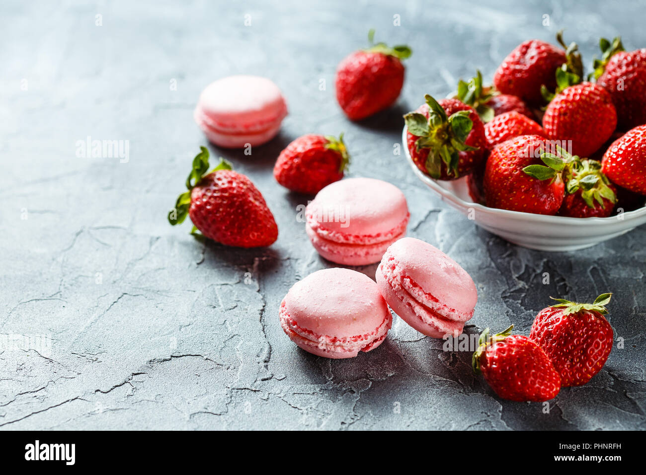 Pink Macaroons with strawberries Stock Photo - Alamy