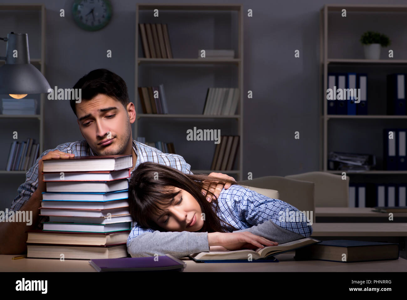 Two students studying late at night Stock Photo - Alamy