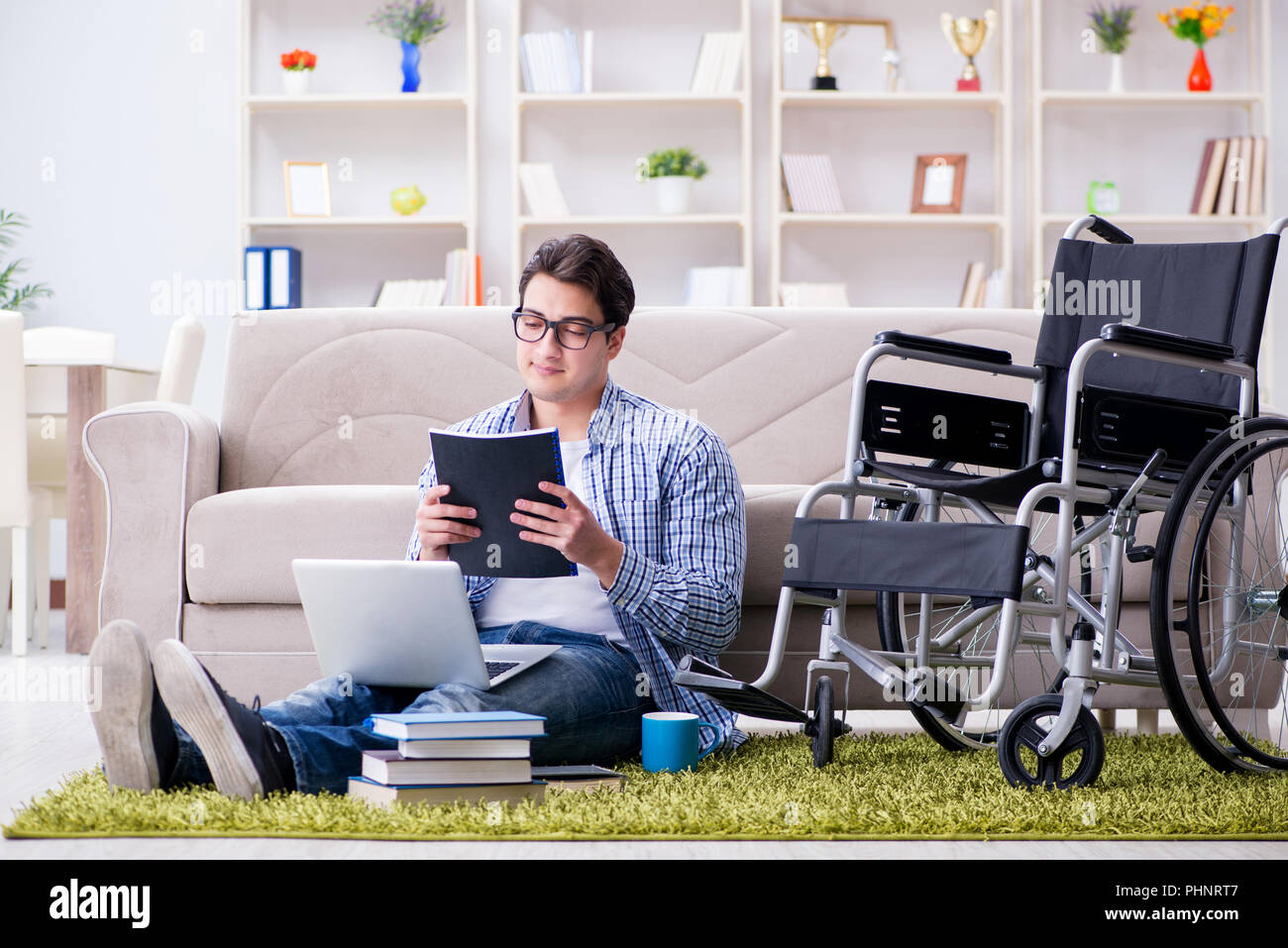 Young student studying at home Stock Photo - Alamy