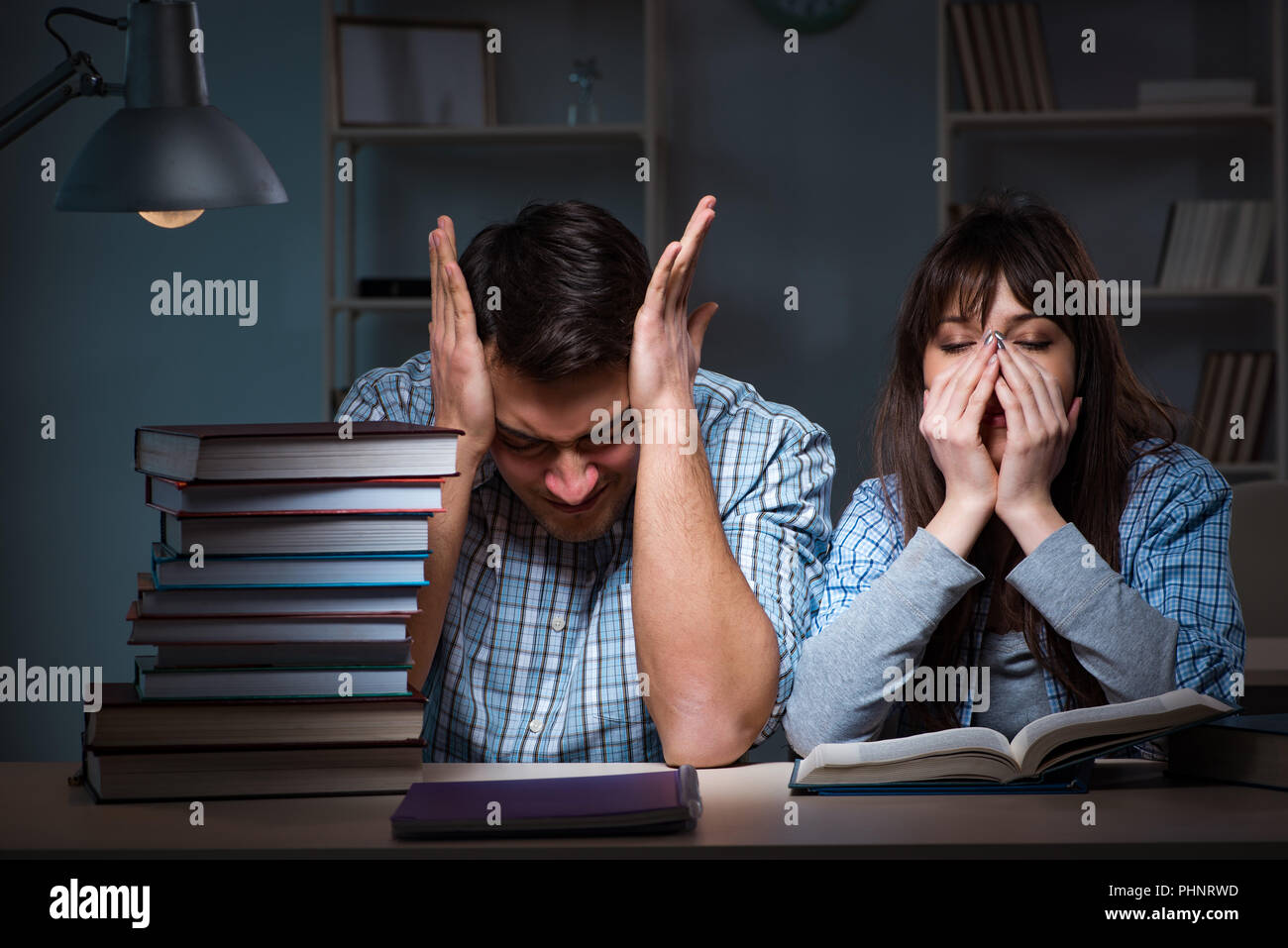 Two students studying late at night Stock Photo - Alamy