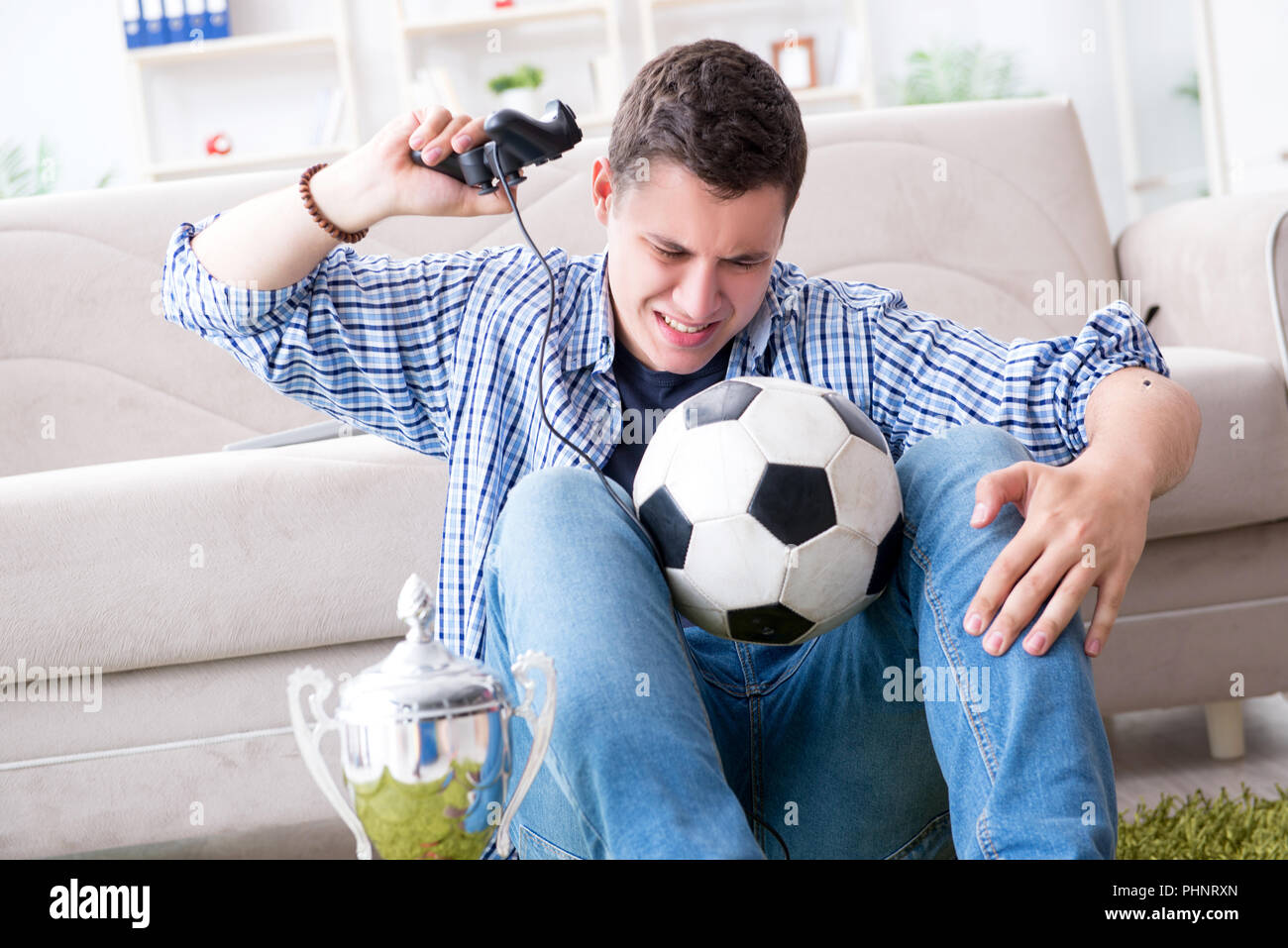Young man playing computer games at home Stock Photo - Alamy