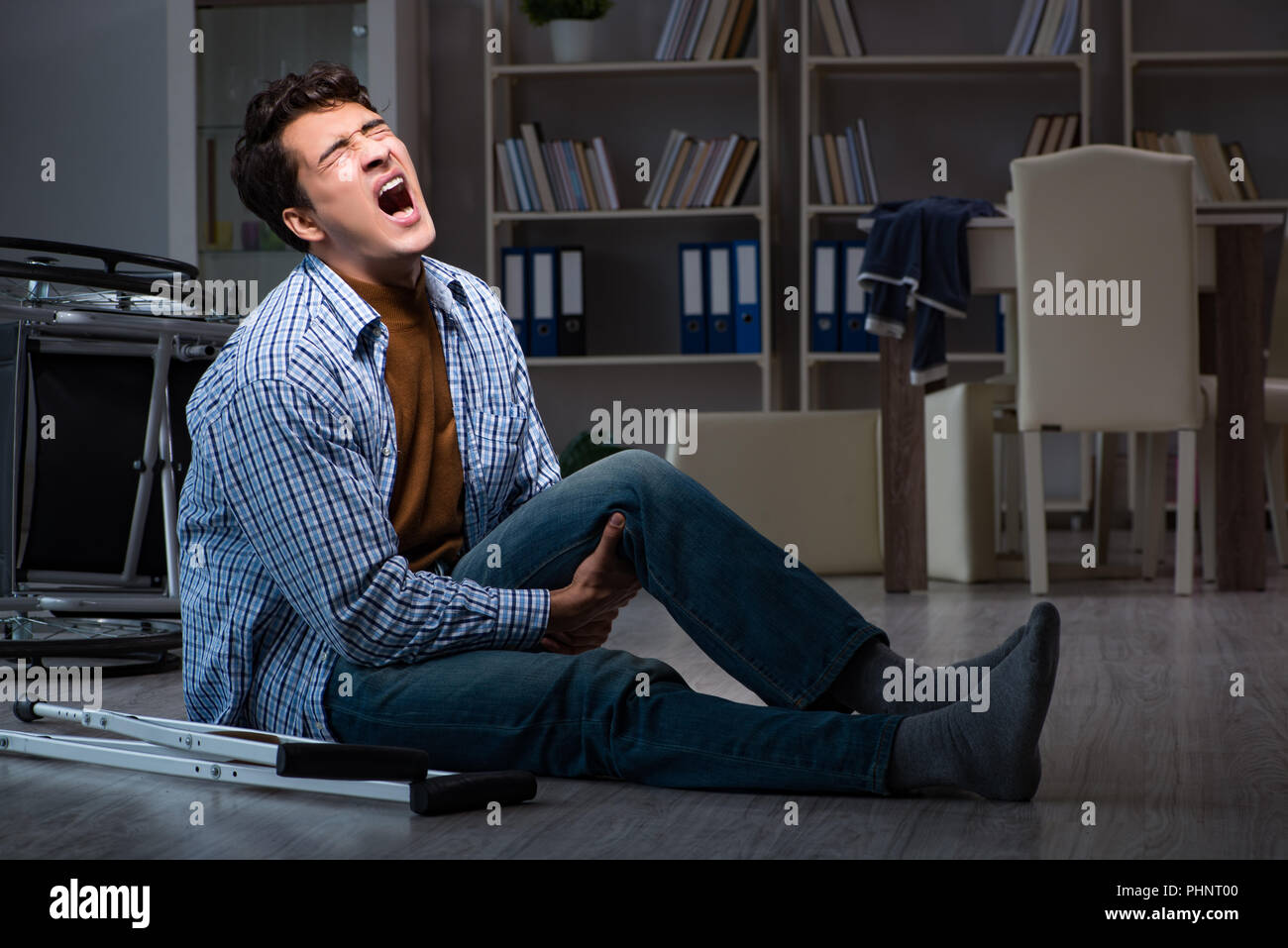 Man fell off wheelchair sitting on the floor Stock Photo - Alamy