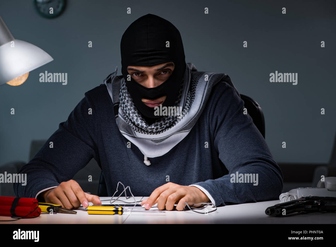Terrorist bomber preparing dynamite bomb Stock Photo - Alamy