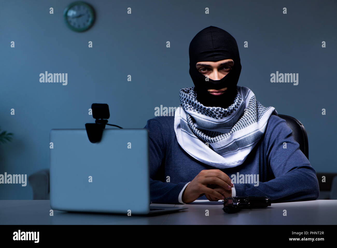 Hacker wearing balaclava mask hacking computer Stock Photo - Alamy