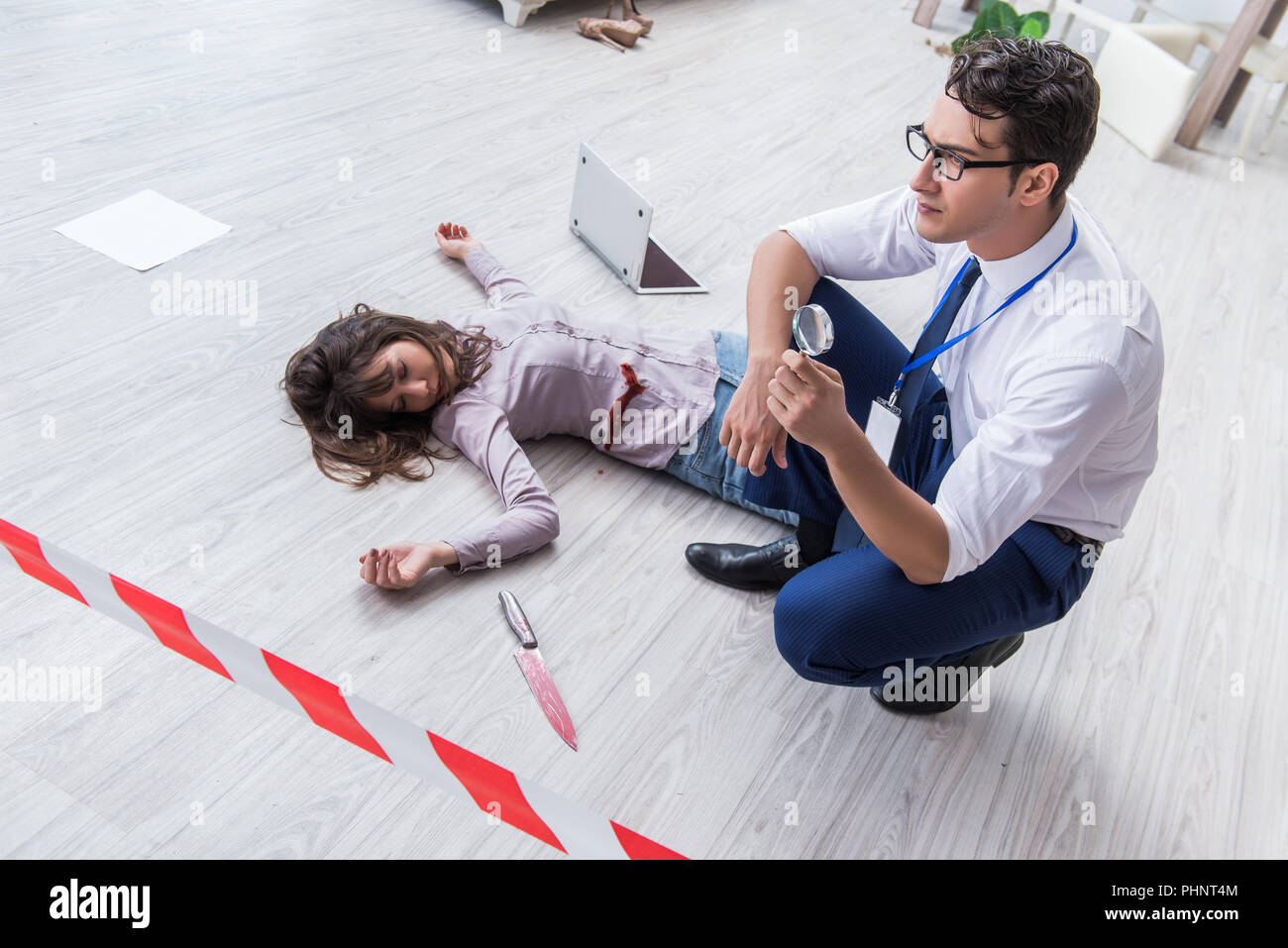 Forensic investigator at the crime scene investigating woman mur Stock ...
