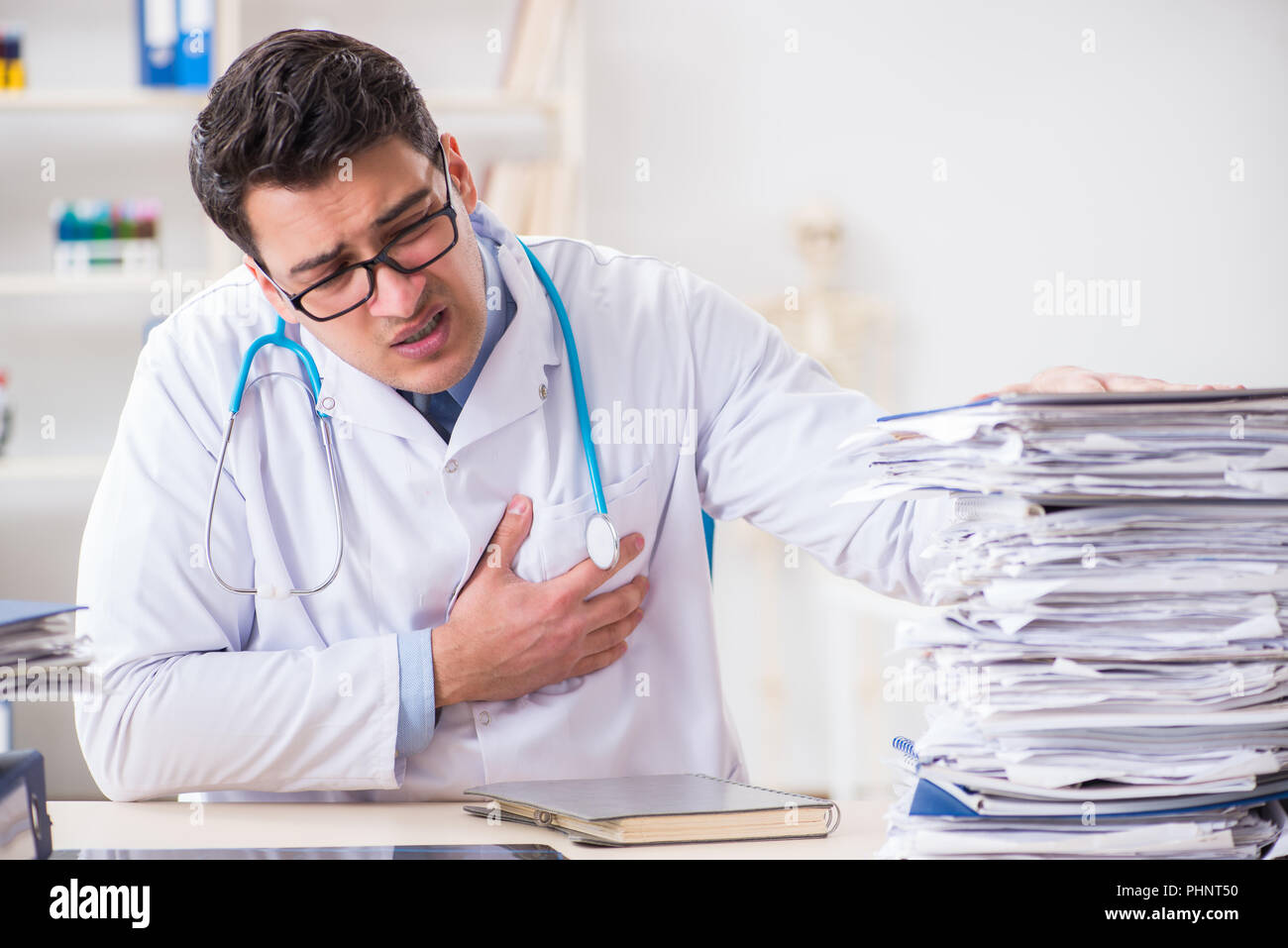 Busy doctor with too much work in hospital Stock Photo - Alamy