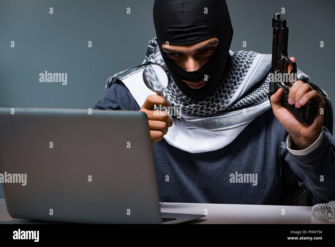 Terrorist burglar with gun asking for money ransom Stock Photo - Alamy