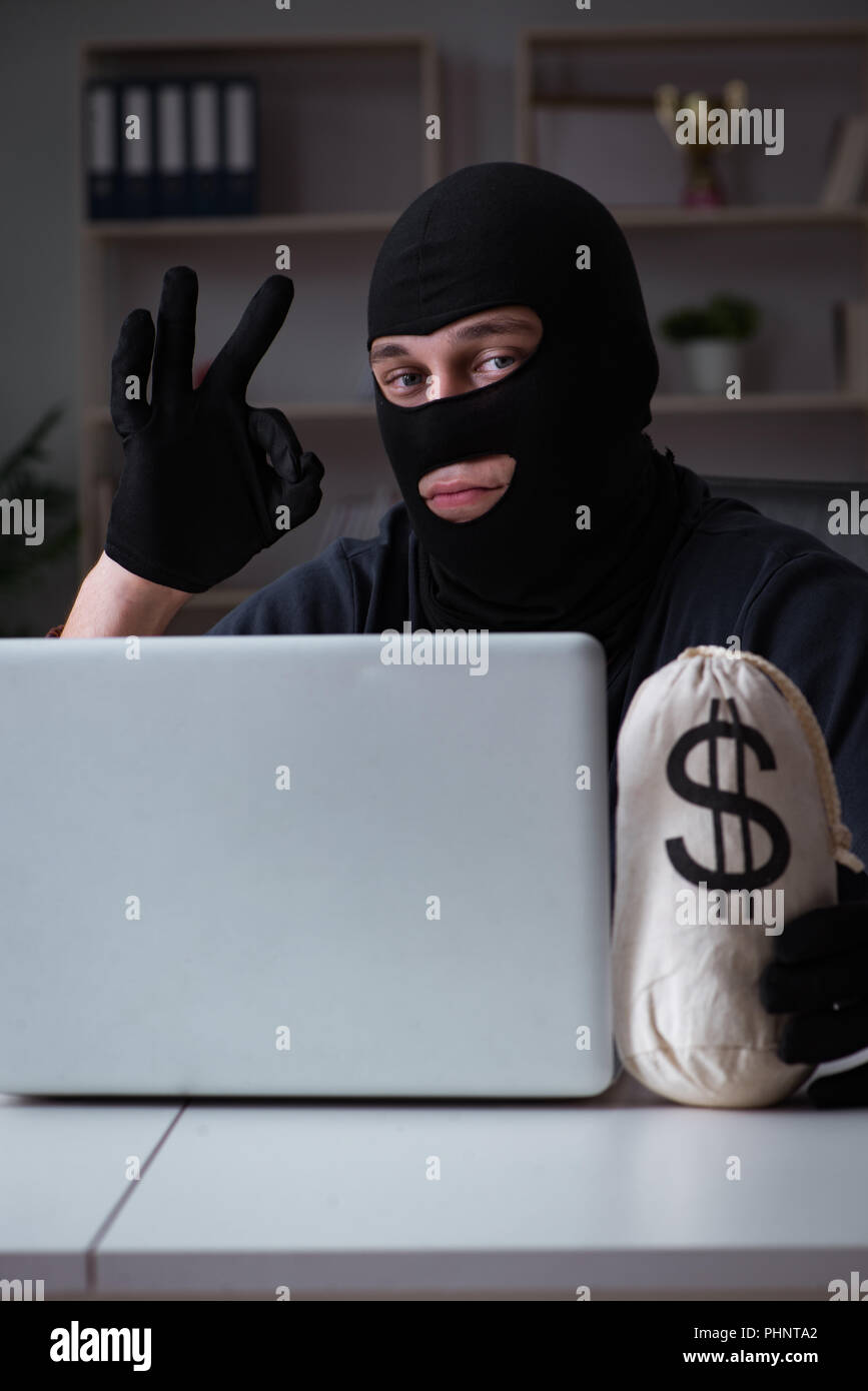 Hacker hacking computer late at night Stock Photo - Alamy