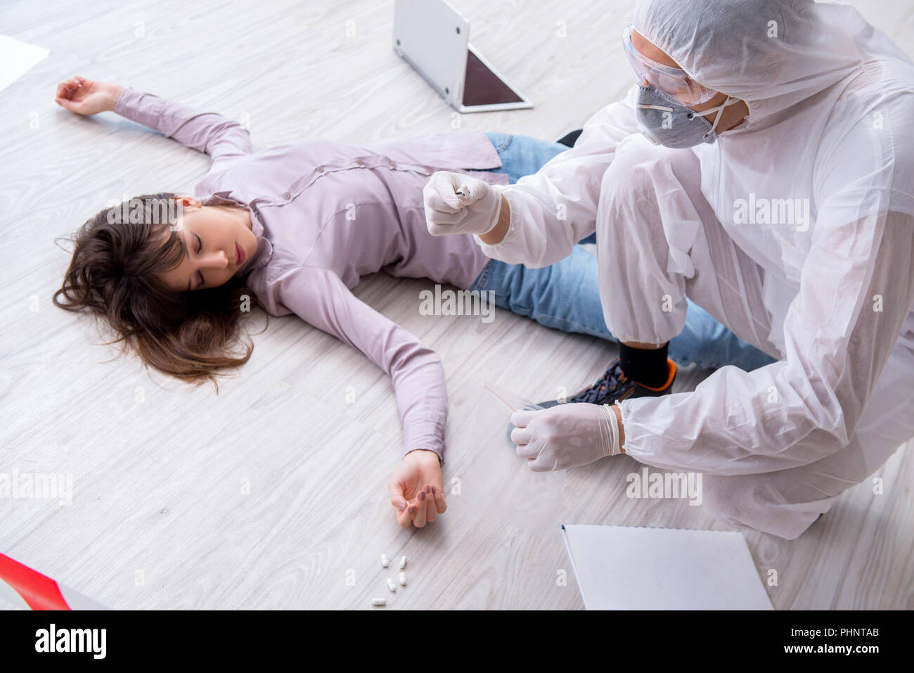 Forensic investigator at the crime scene investigating woman mur Stock ...