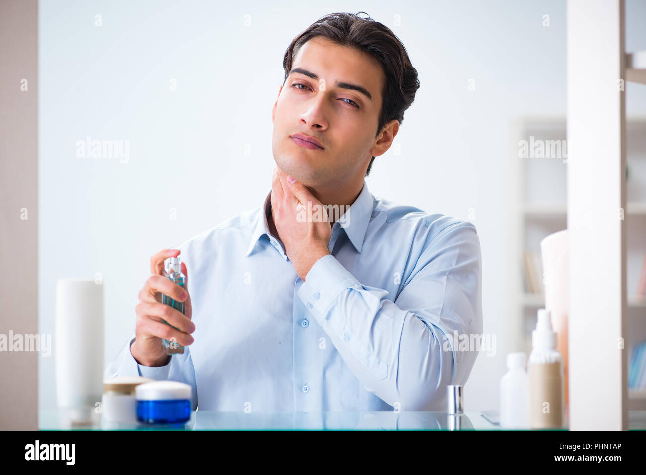 Man is getting dressed up for work in bathroom Stock Photo - Alamy