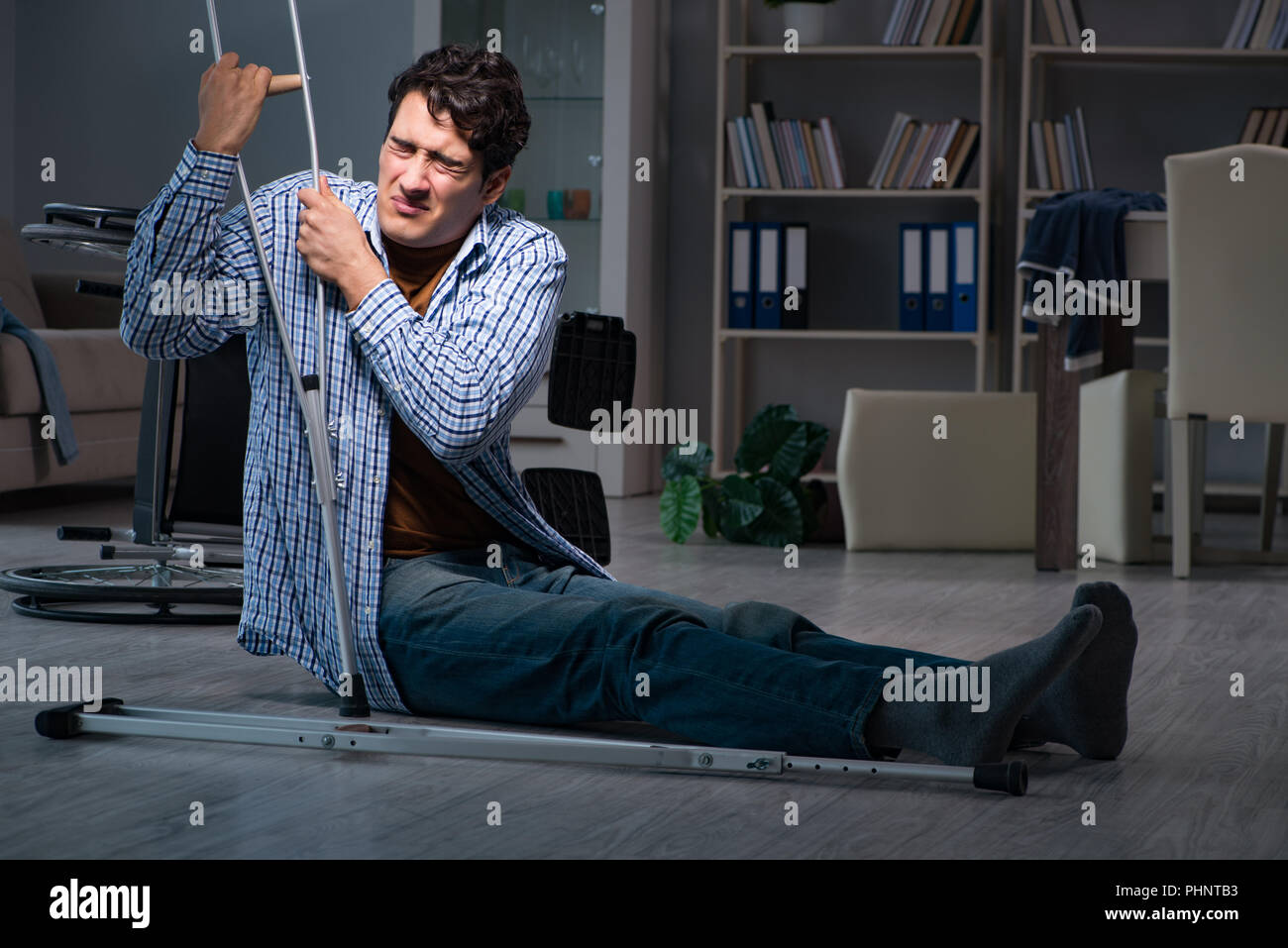 Man fell off wheelchair sitting on the floor Stock Photo - Alamy
