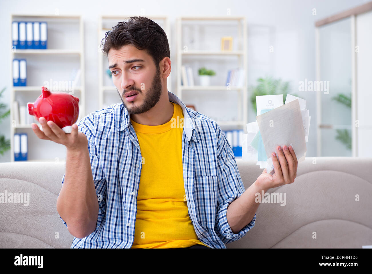 Man angry at bills he needs to pay Stock Photo - Alamy