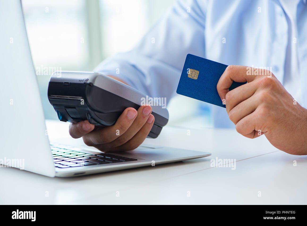 Man processing credit card transaction with POS terminal Stock Photo ...