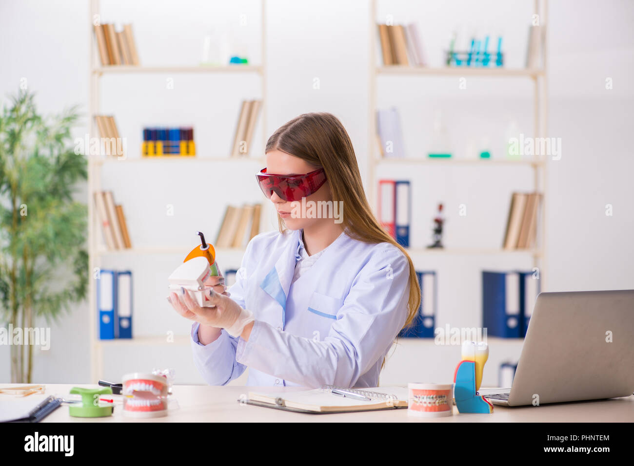 Dentistry student practicing skills in classroom Stock Photo - Alamy