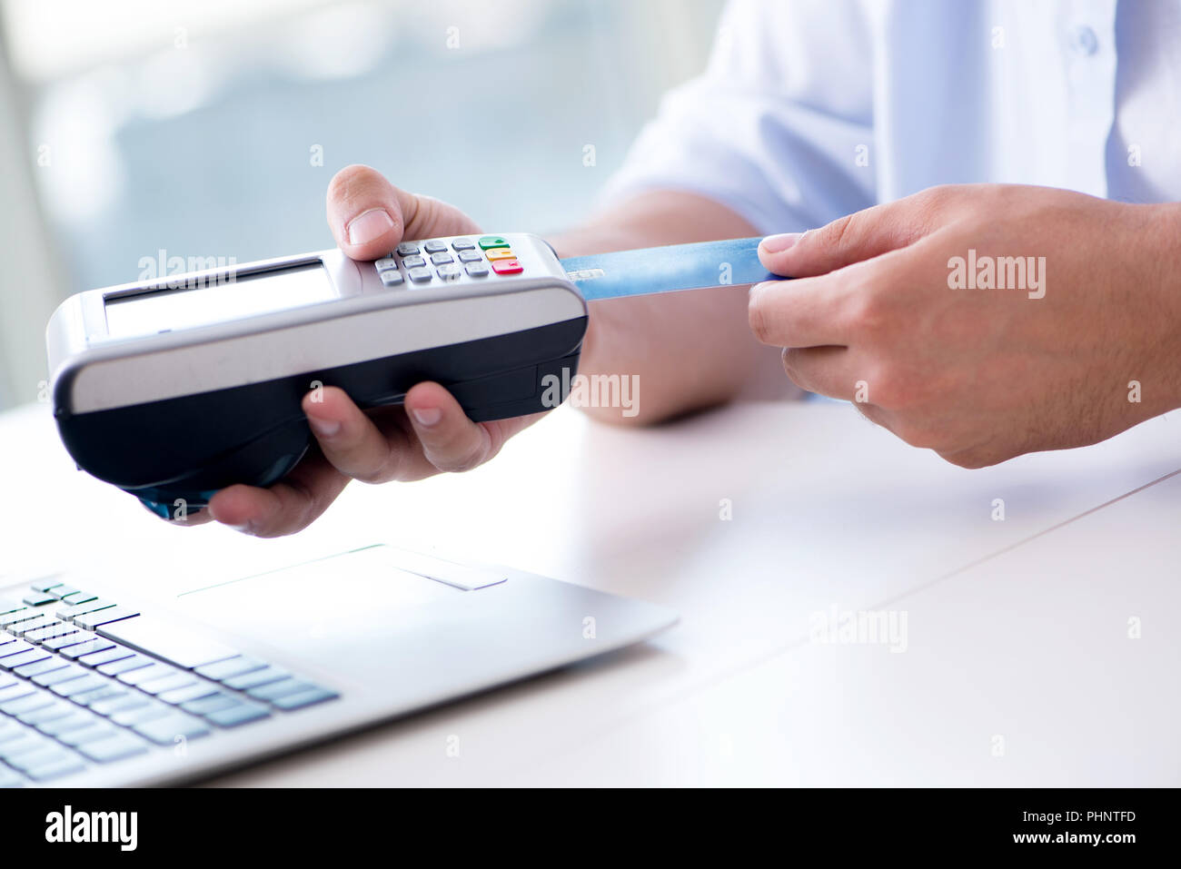 Man processing credit card transaction with POS terminal Stock Photo ...