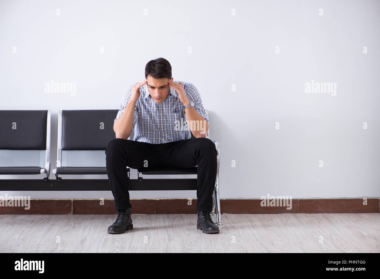 Man nervously impatiently waiting in the lobby Stock Photo - Alamy