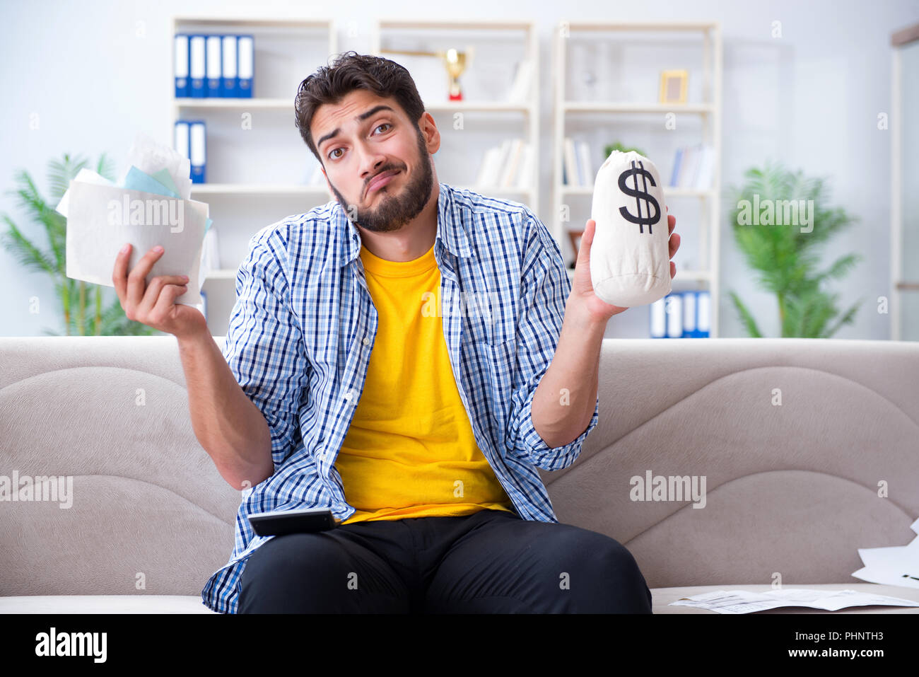 Man angry at bills he needs to pay Stock Photo - Alamy