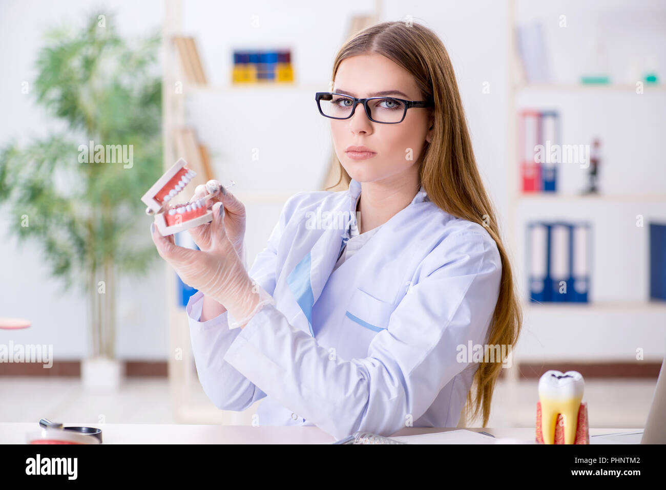 Dentistry student practicing skills in classroom Stock Photo - Alamy