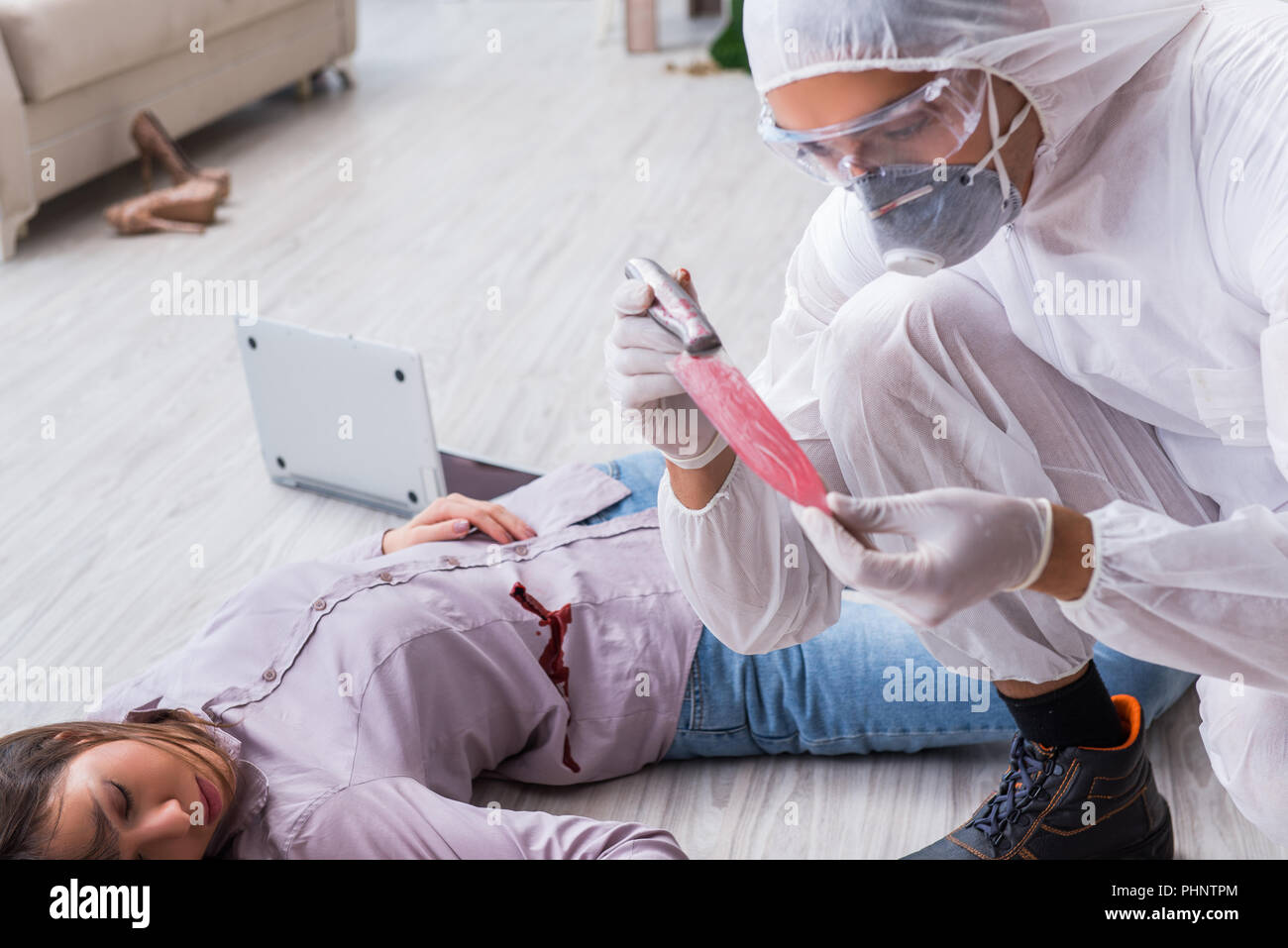 Forensic Investigator At The Crime Scene Investigating Woman Mur Stock