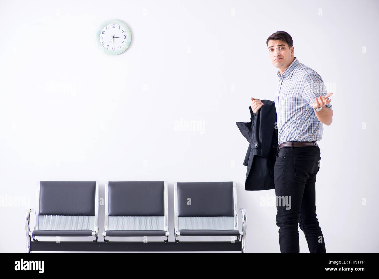 Man nervously impatiently waiting in the lobby Stock Photo - Alamy