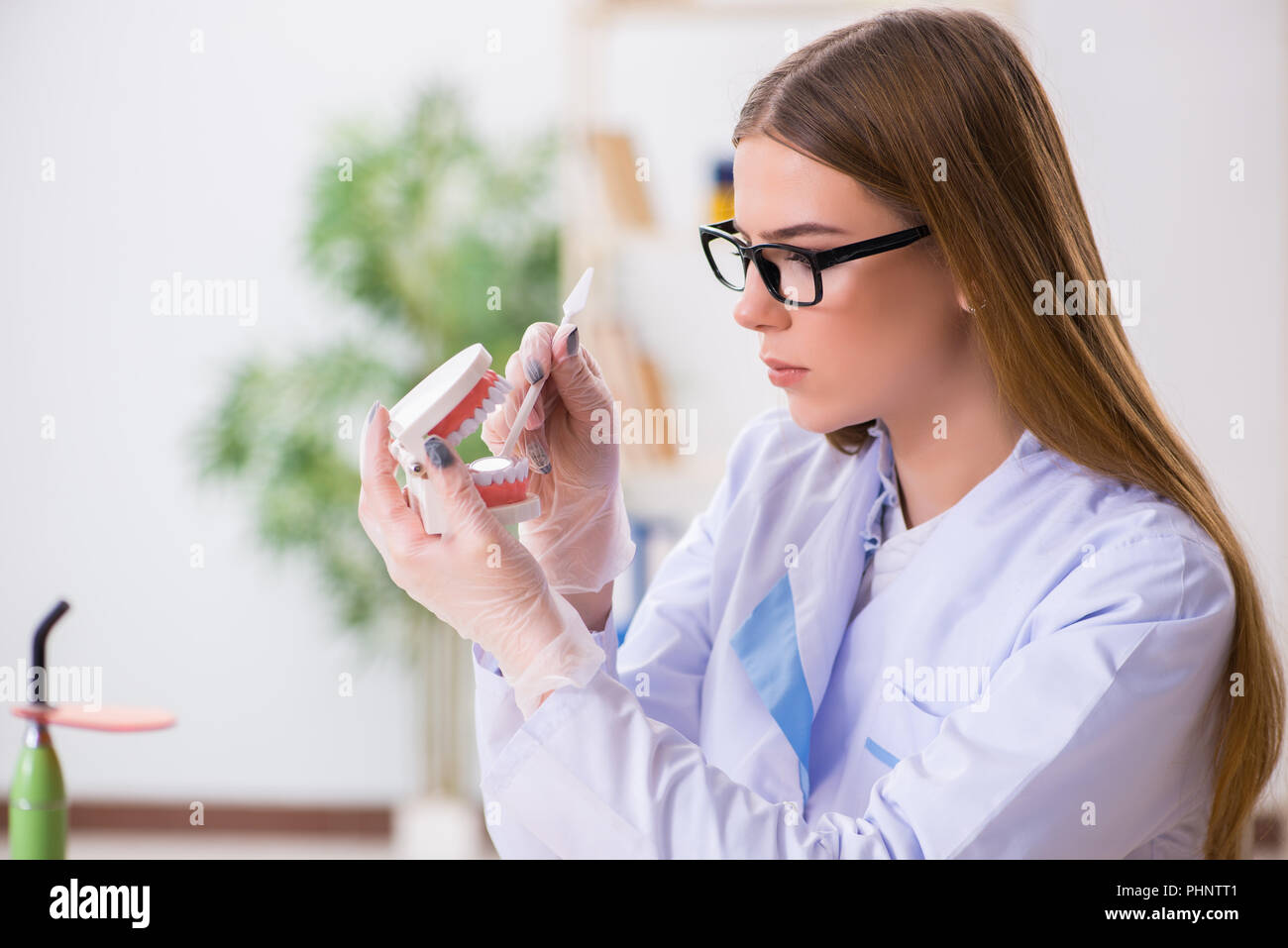 Dentistry student practicing skills in classroom Stock Photo - Alamy