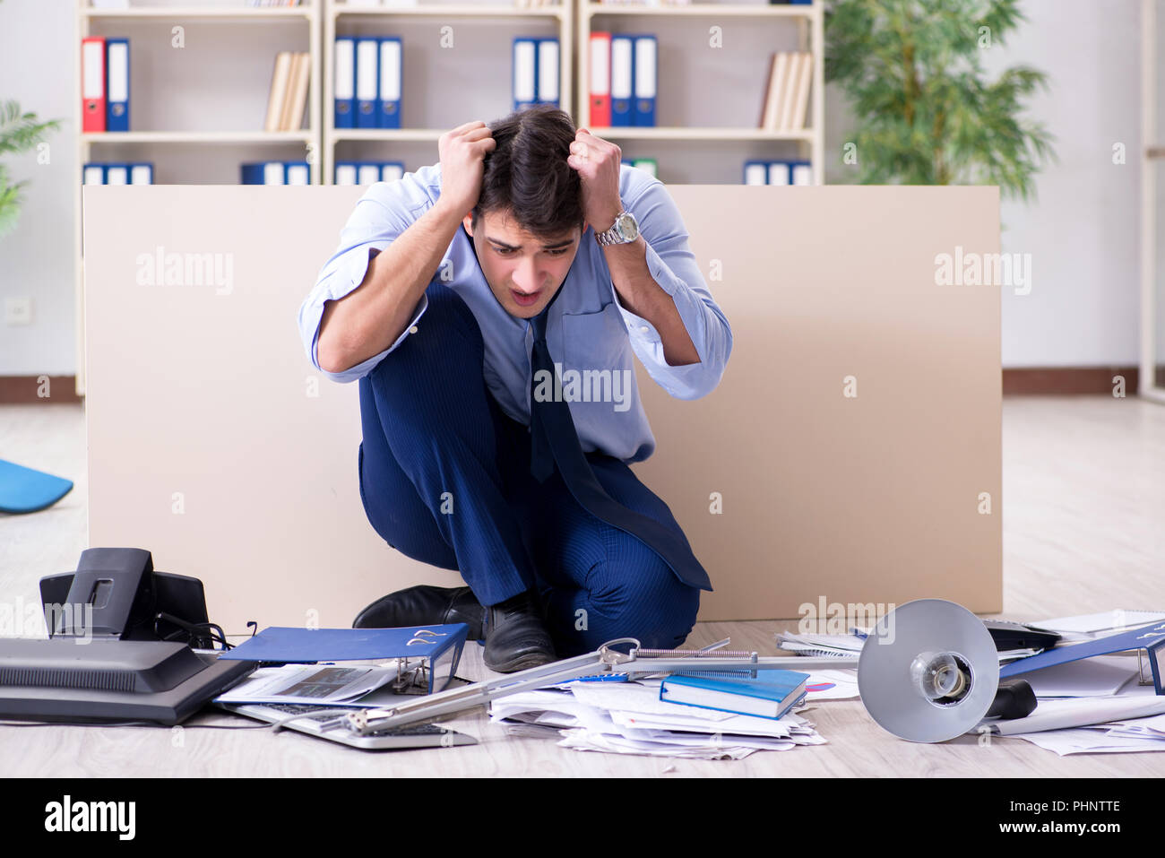 Angry businessman frustrated with too much work Stock Photo - Alamy