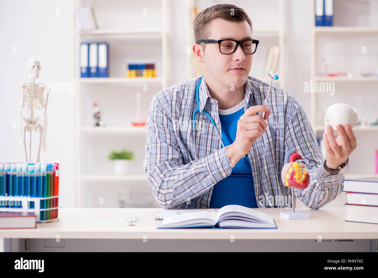 Medical student studying skeleton in classroom during lecture Stock ...