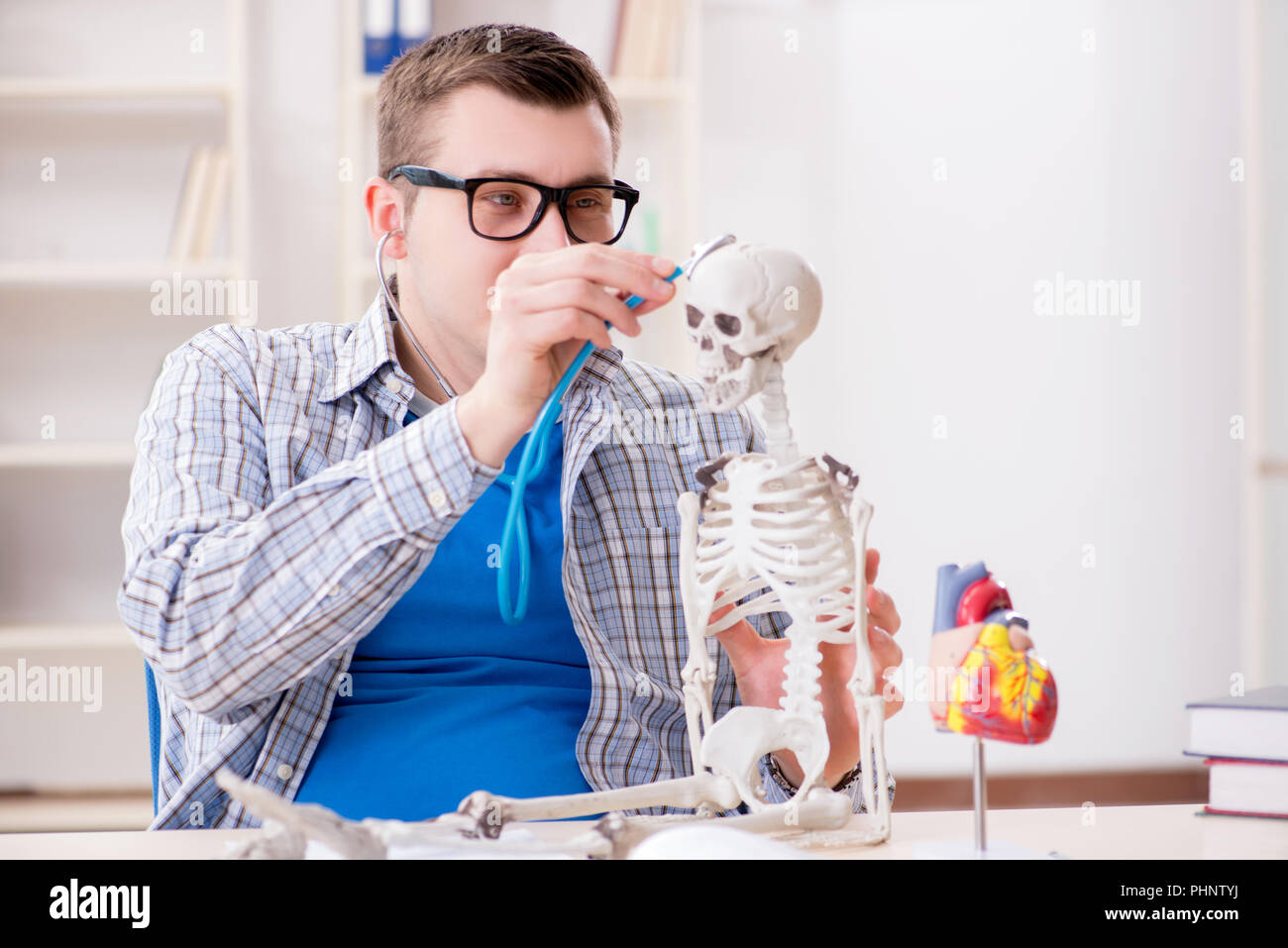 Medical student studying skeleton in classroom during lecture Stock ...