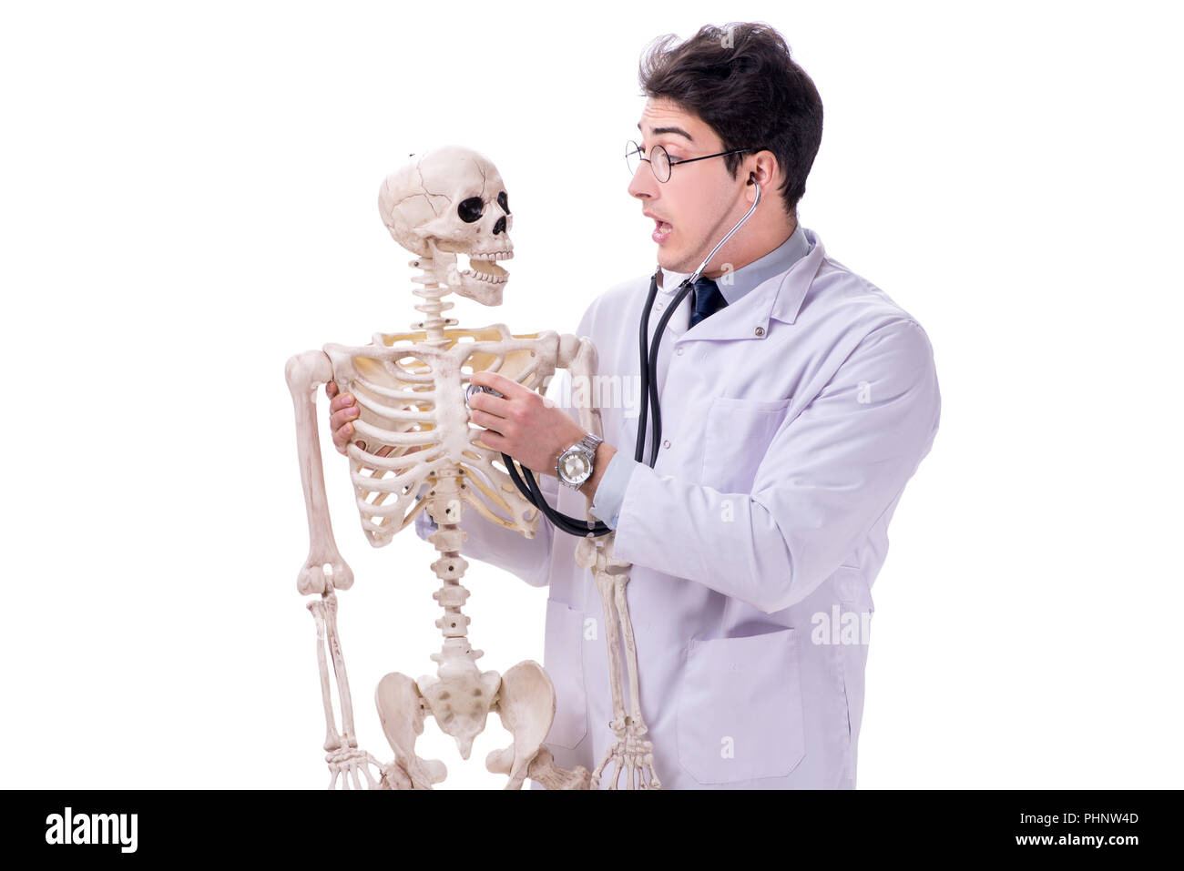Young doctor with skeleton isolated on white Stock Photo - Alamy