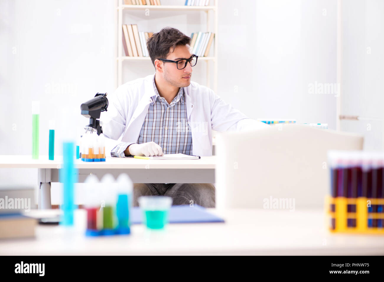 Chemistry student doing chemical experiments at classroom activi Stock ...