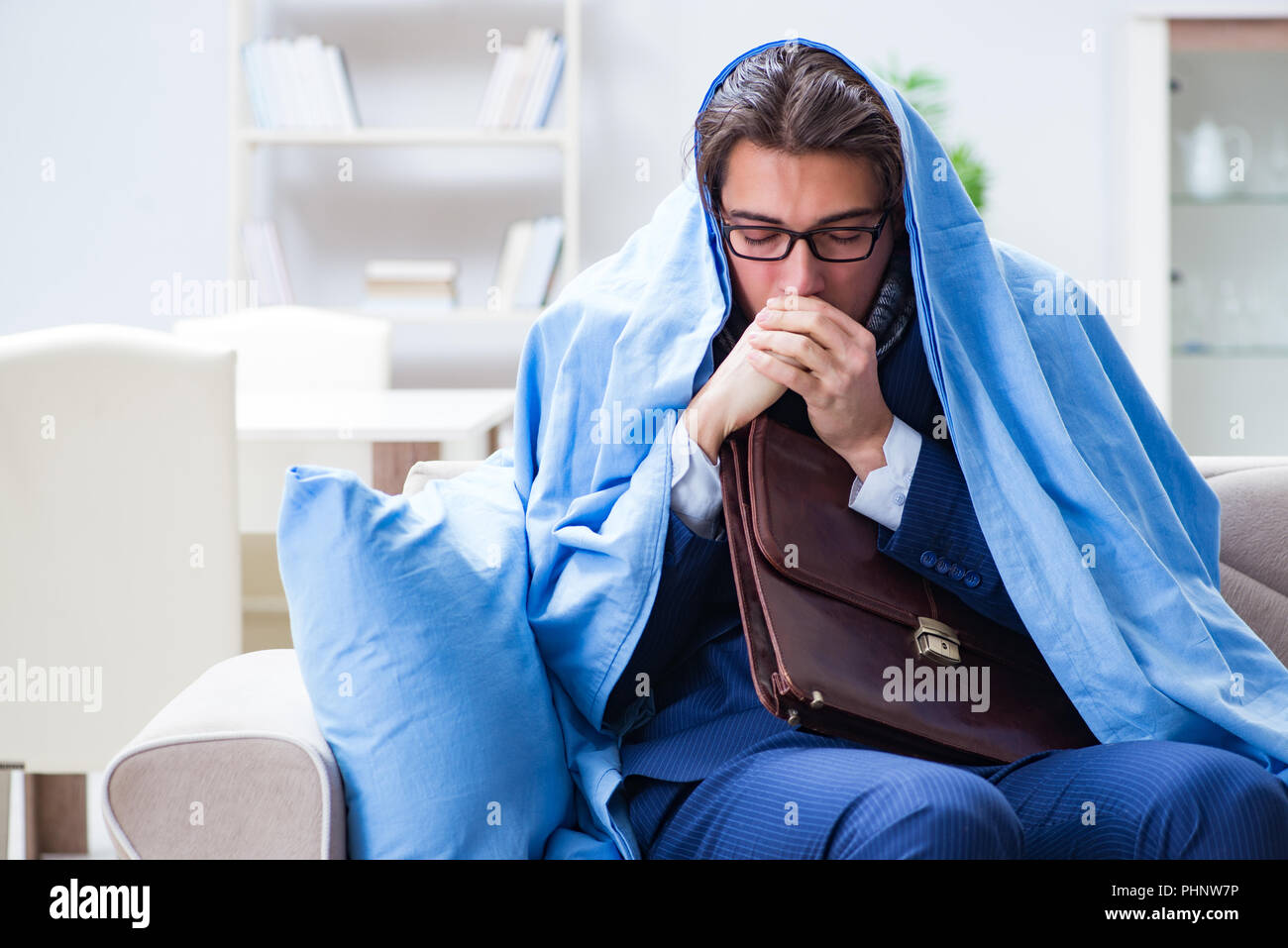 Sick employee staying at home suffering from flue Stock Photo - Alamy