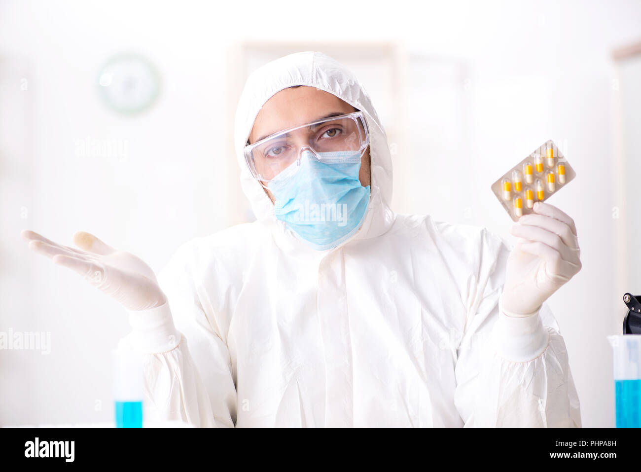 Lab assistant in drug synthesis concept Stock Photo - Alamy